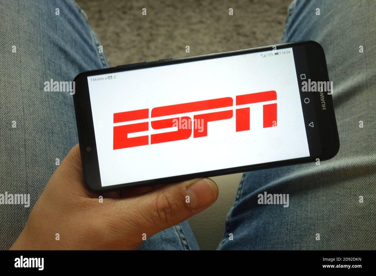 Man holding smartphone with Espn channel logo Stock Photo - Alamy