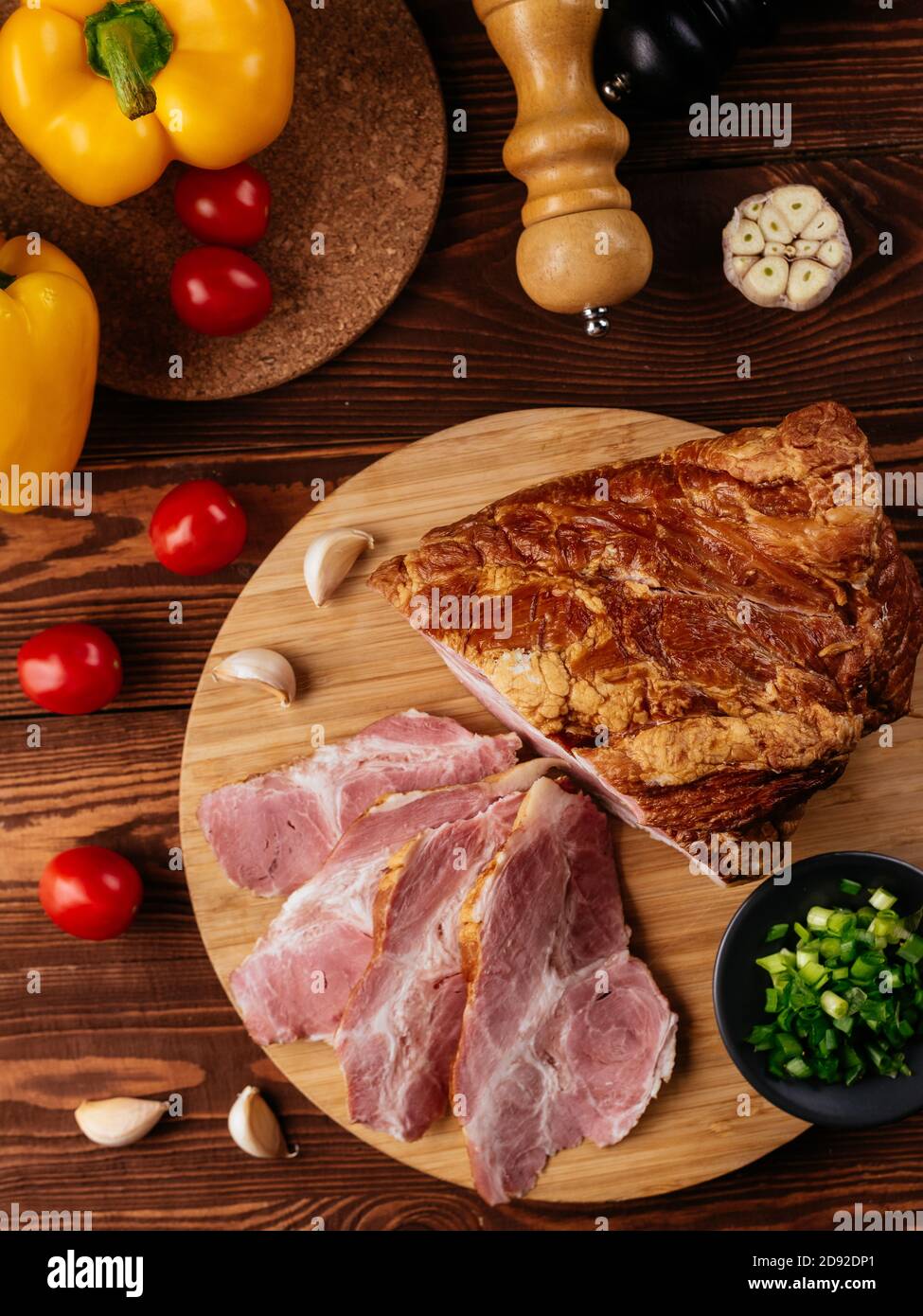 ham sliced on a background with vegetables and spices Stock Photo - Alamy