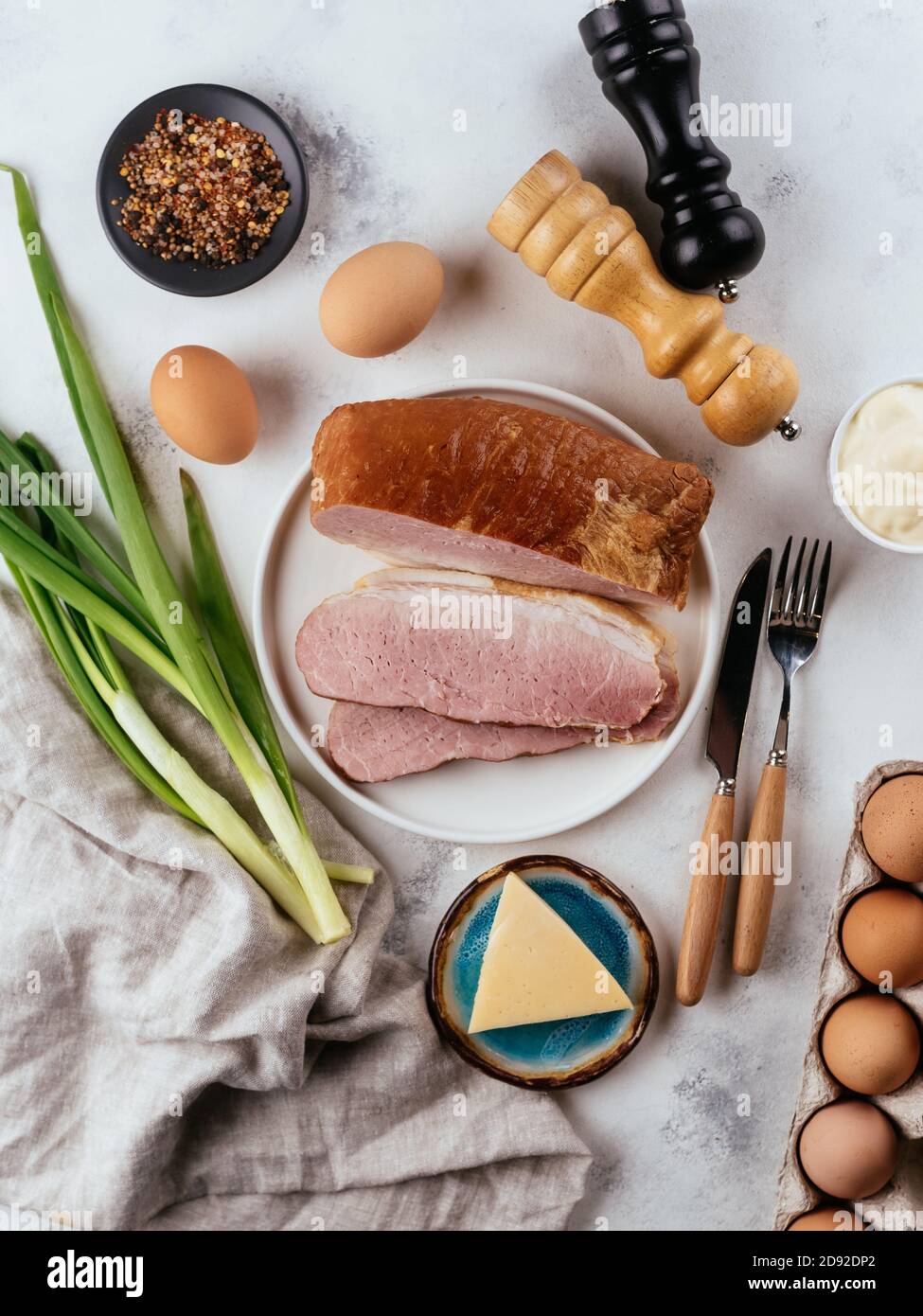 ham sliced on a background with vegetables and spices Stock Photo - Alamy