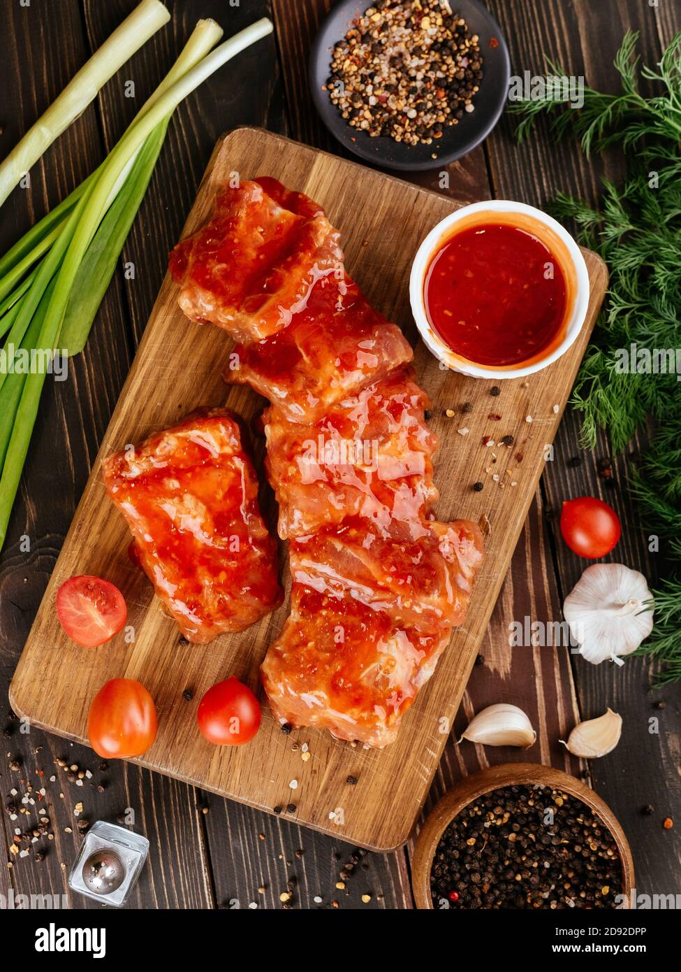 fresh pork meat with spices and vegetables Stock Photo - Alamy