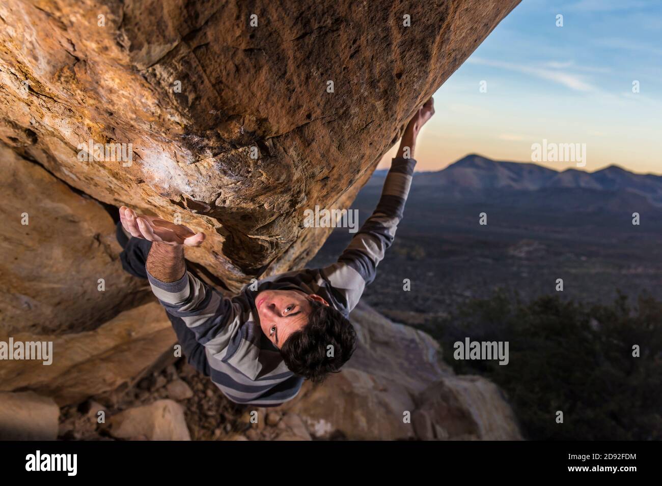 Mountaineer climbing a rock formation hi-res stock photography and ...