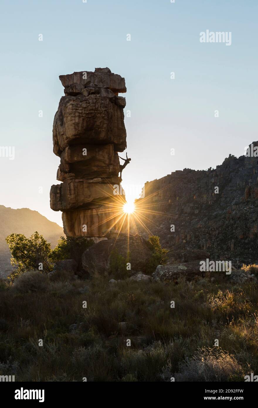 Athletic male climbs outside on a boulder with sun rays Stock Photo - Alamy