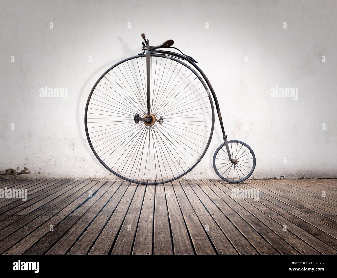 penny-farthing, high wheel retro bike on wood floor Stock Photo - Alamy