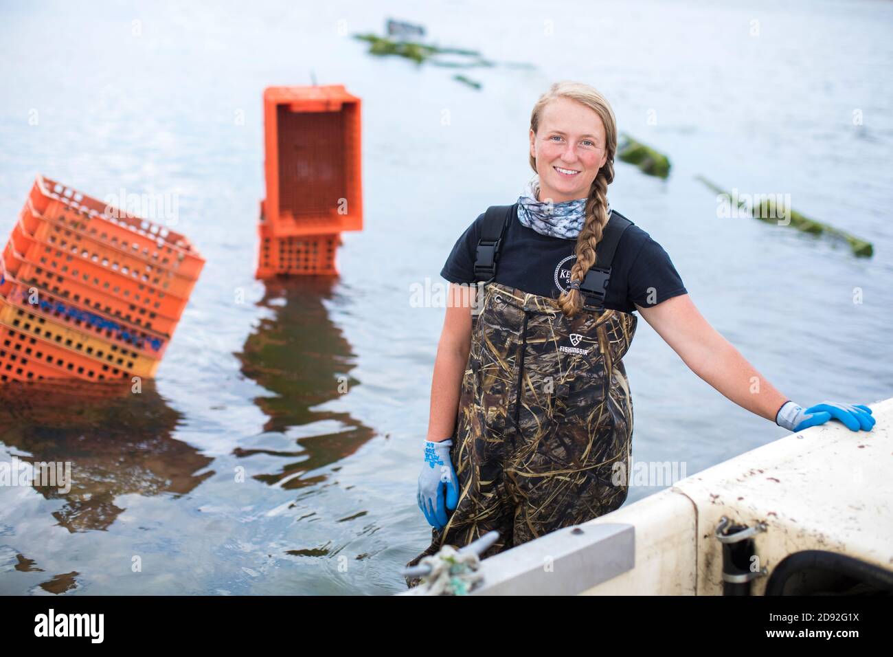 Portrait of Female Shellfish Farmner Standing in Water Stock Photo - Alamy