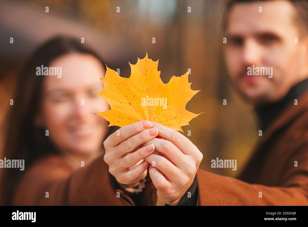 Happy family walking in autumn park on sunny fall day Stock Photo - Alamy
