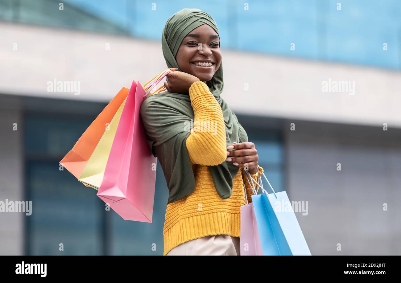 Islamic Shopping. Cheerful Black Muslim Woman Posing With Colorful ...