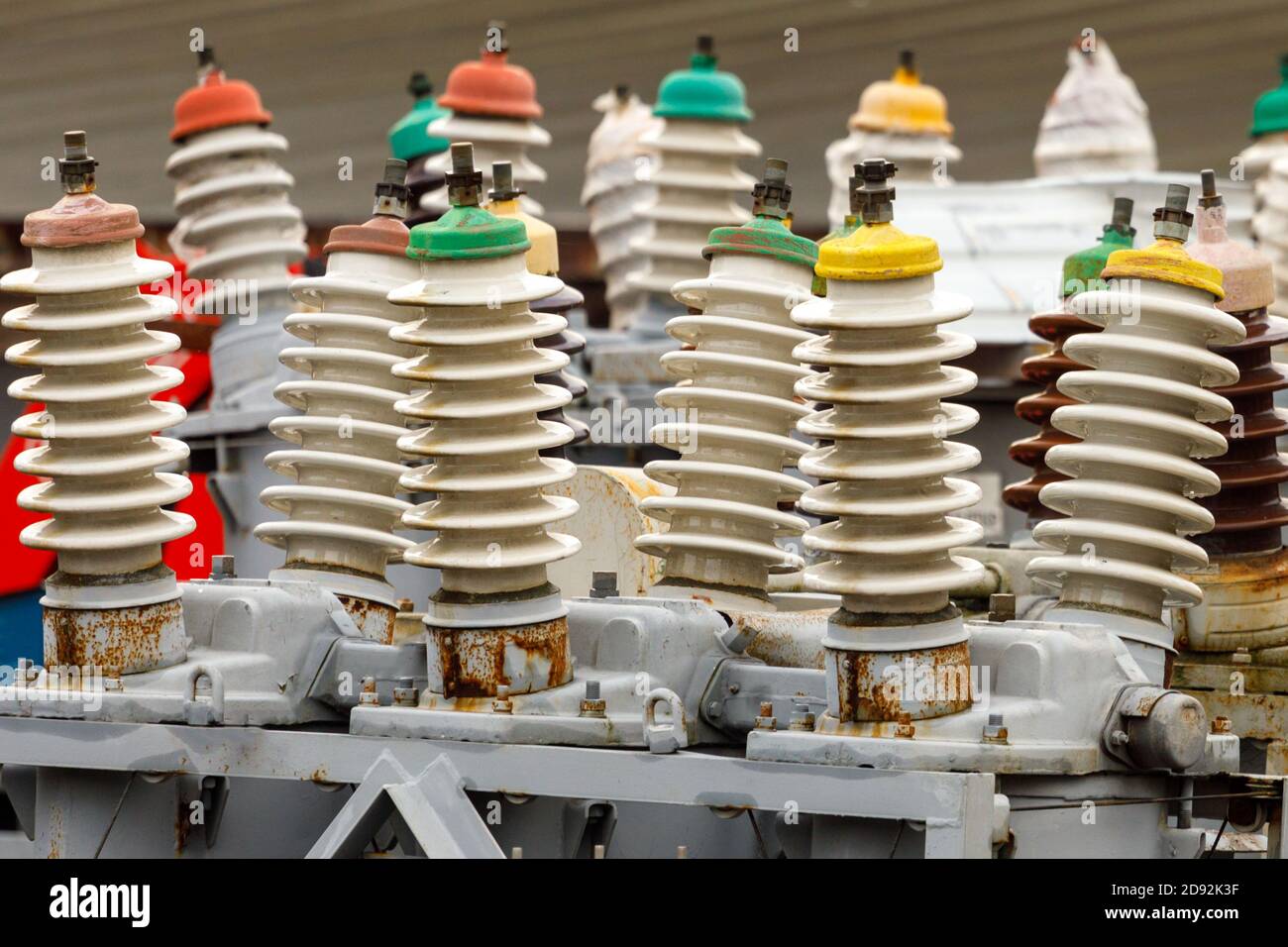 colored insulators on electrical towers close-up Stock Photo - Alamy