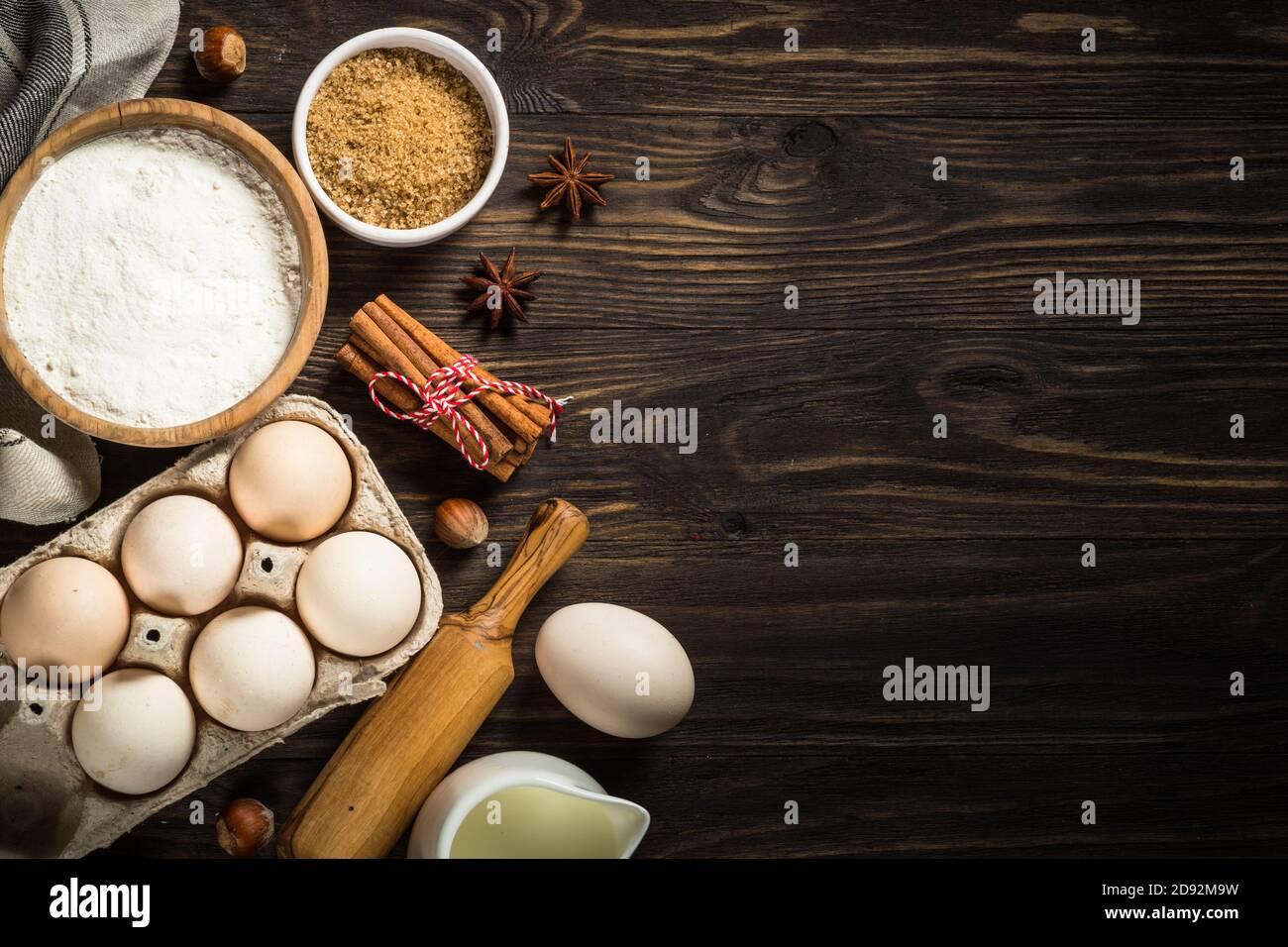 Baking ingredients on kitchen table Stock Photo - Alamy
