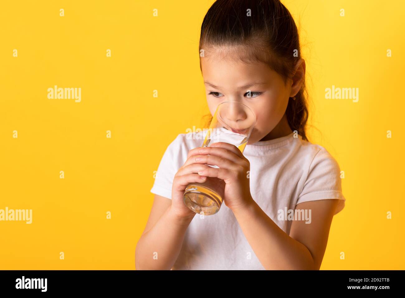 Portrait of asian girl drinking spring water Stock Photo - Alamy