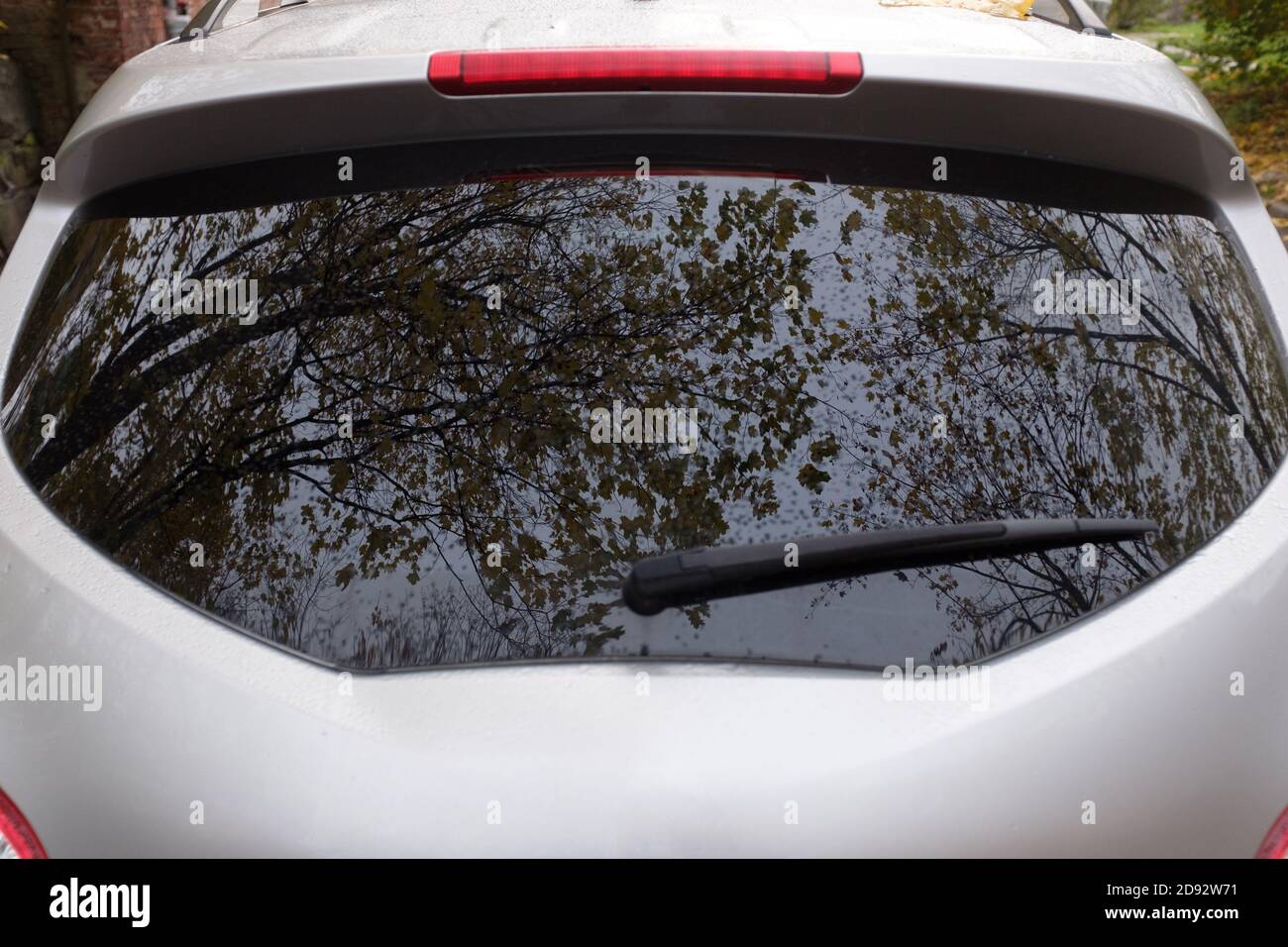 White car rear window with wiper Stock Photo - Alamy