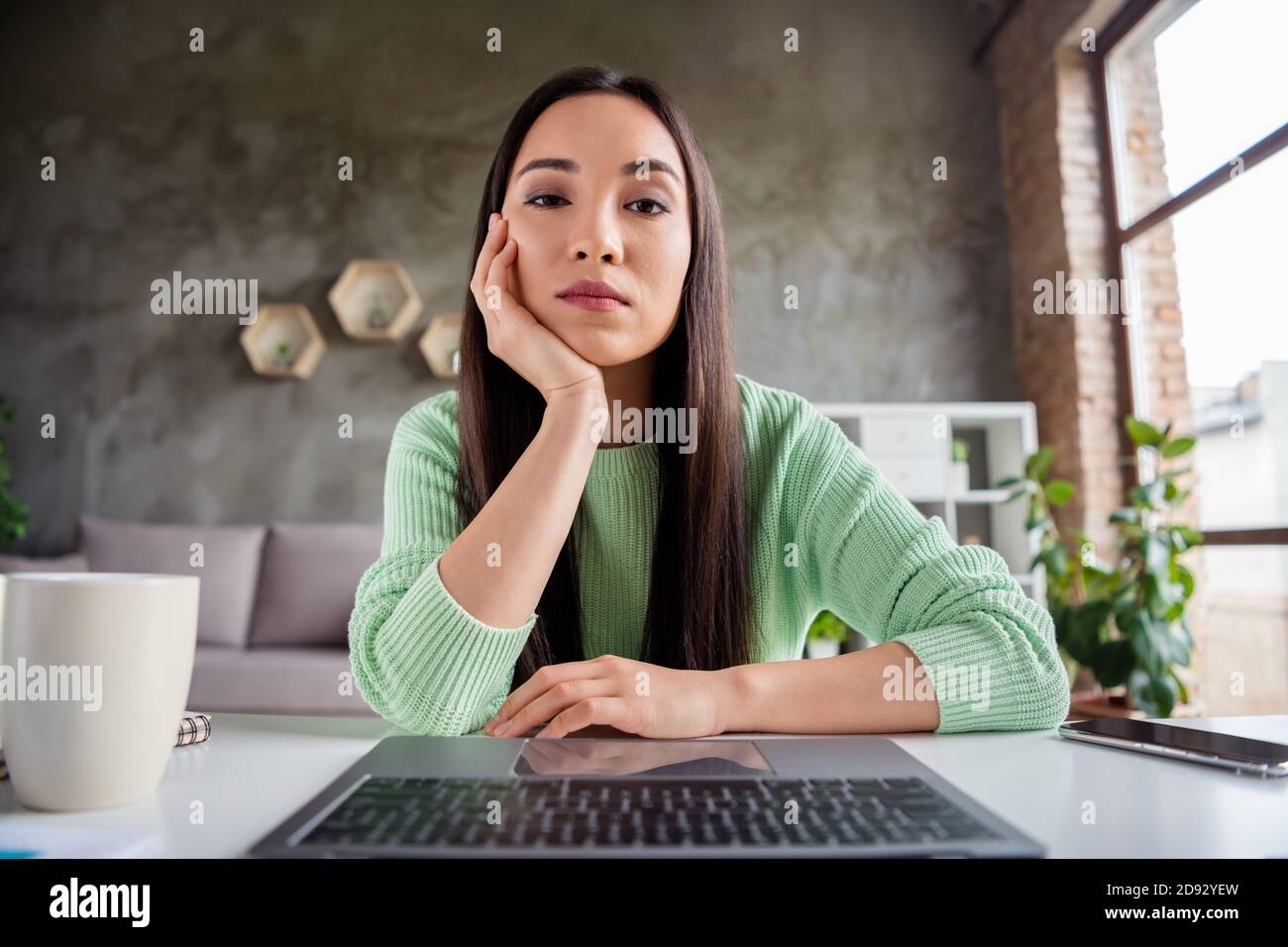 Close up photo of tired chinese girl sit desk use laptop web camera ...
