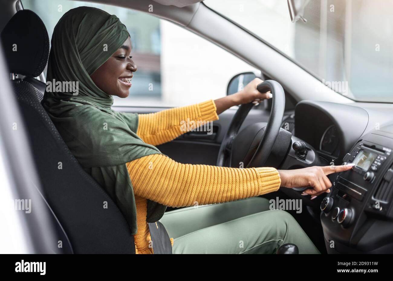 Woman Listening To Radio In Car