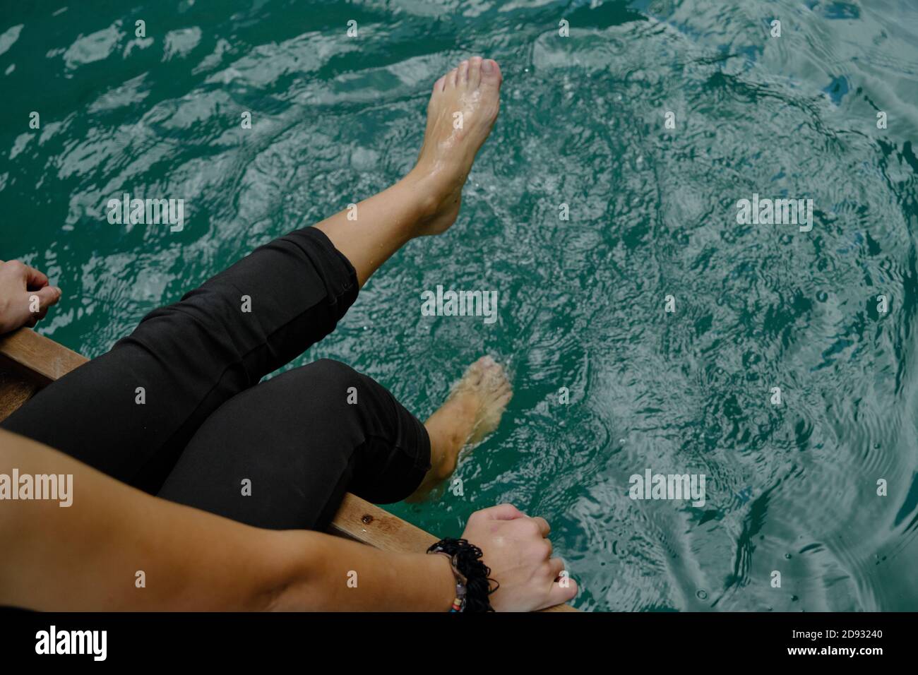 girl at the pond feet in the water Stock Photo - Alamy