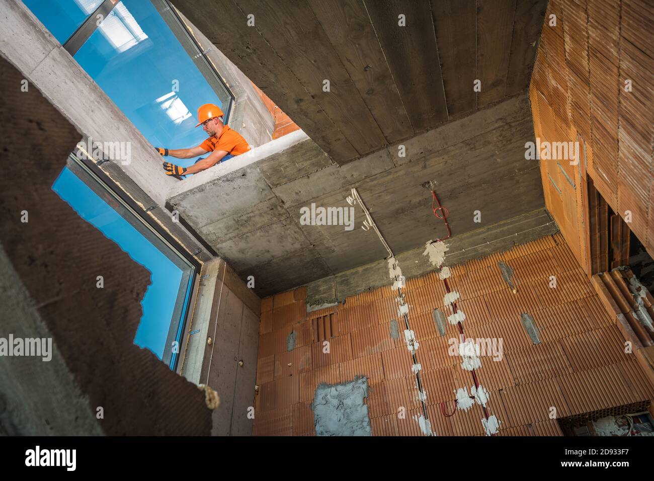 Caucasian Construction Site Worker Wearing Hard Hat Finishing Building ...