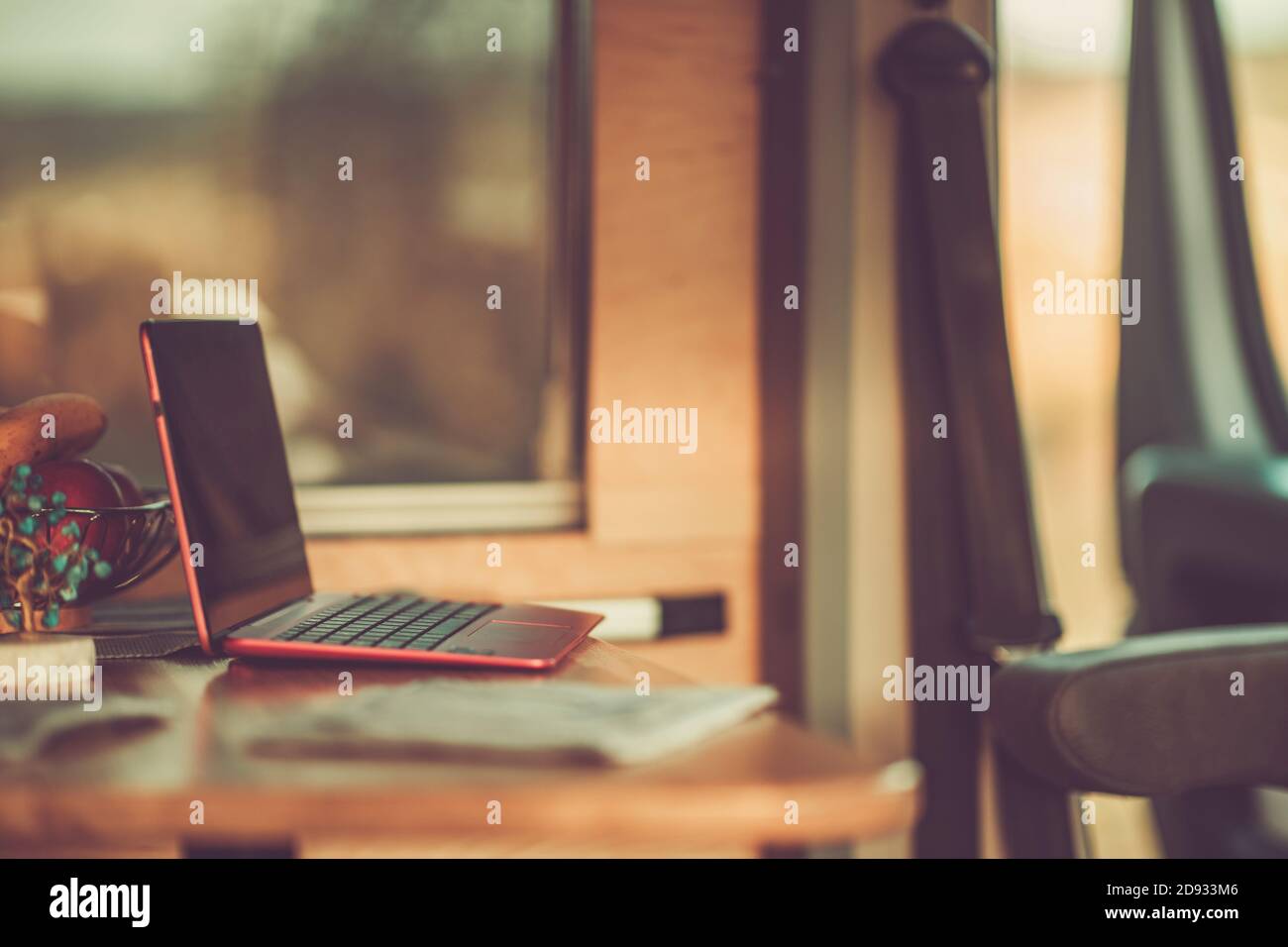 Camping Theme. Laptop Computer on RV Camper Van Table. Remote Place ...