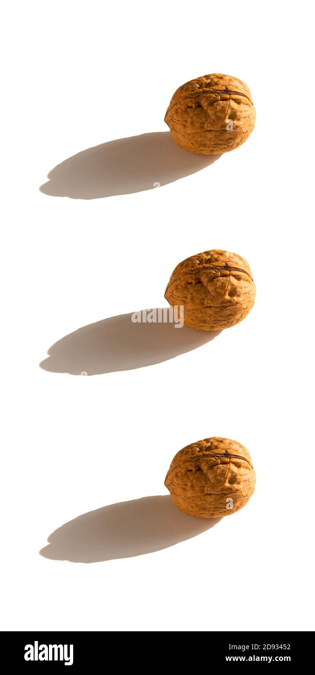 three walnuts on white background Stock Photo - Alamy