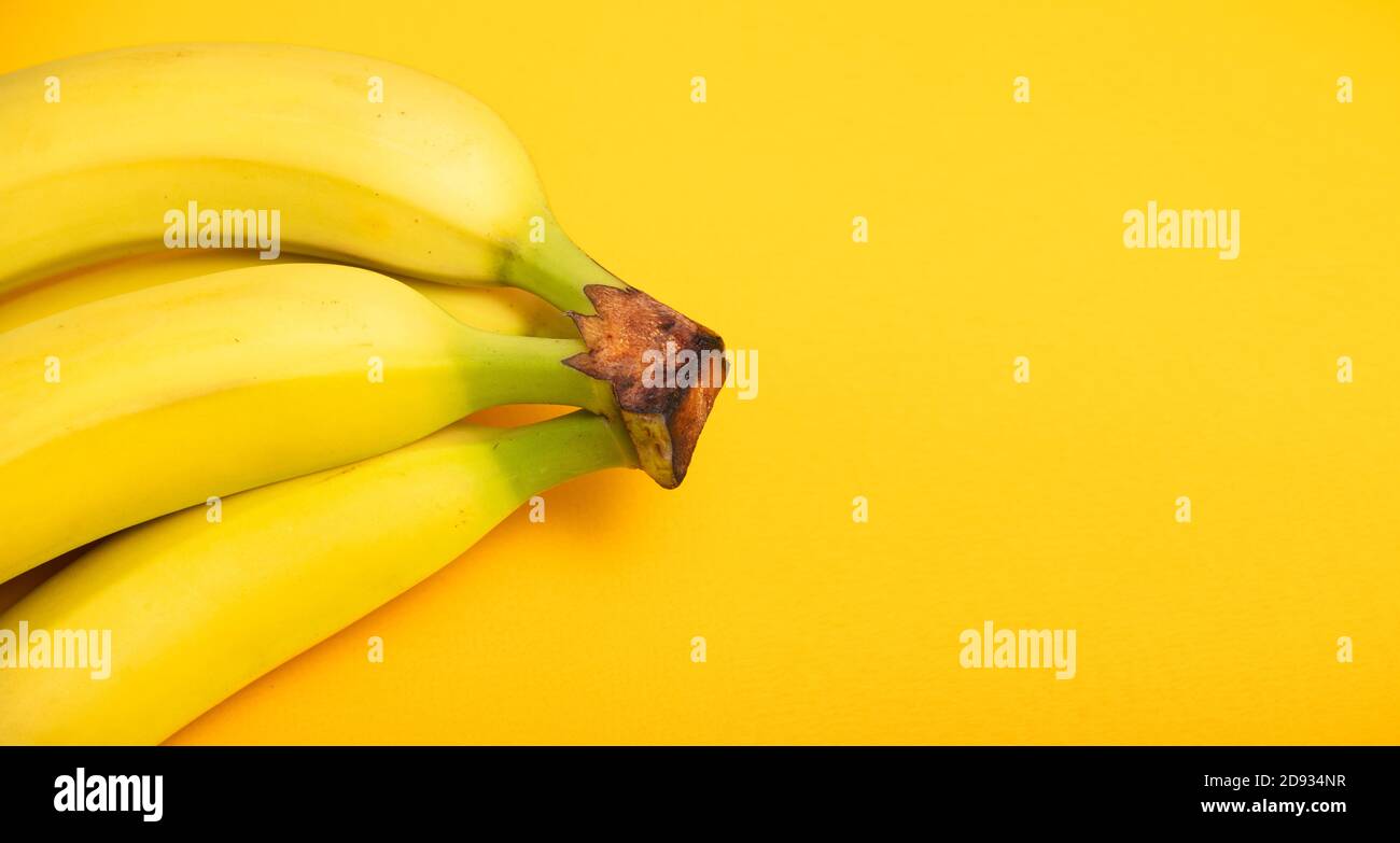 bananas on a yellow background with an empty space under the text Stock ...