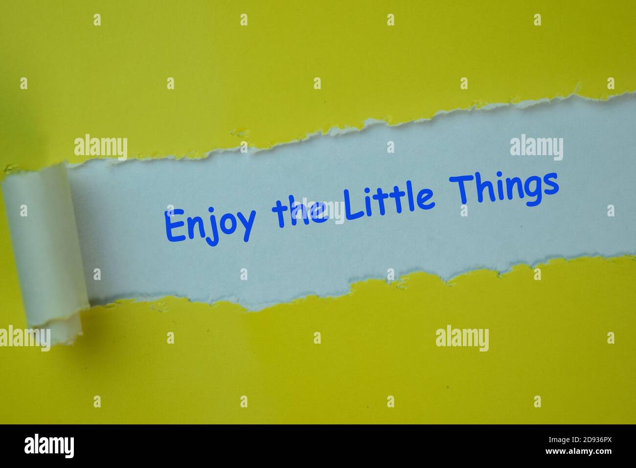 Enjoy the Little Things Text written in torn paper Stock Photo - Alamy