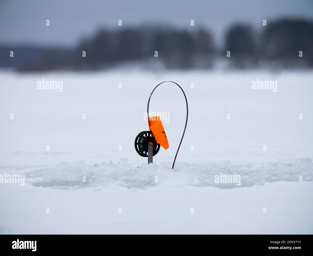 equipment for winter fishing on ice. imitation fish and drill for ...