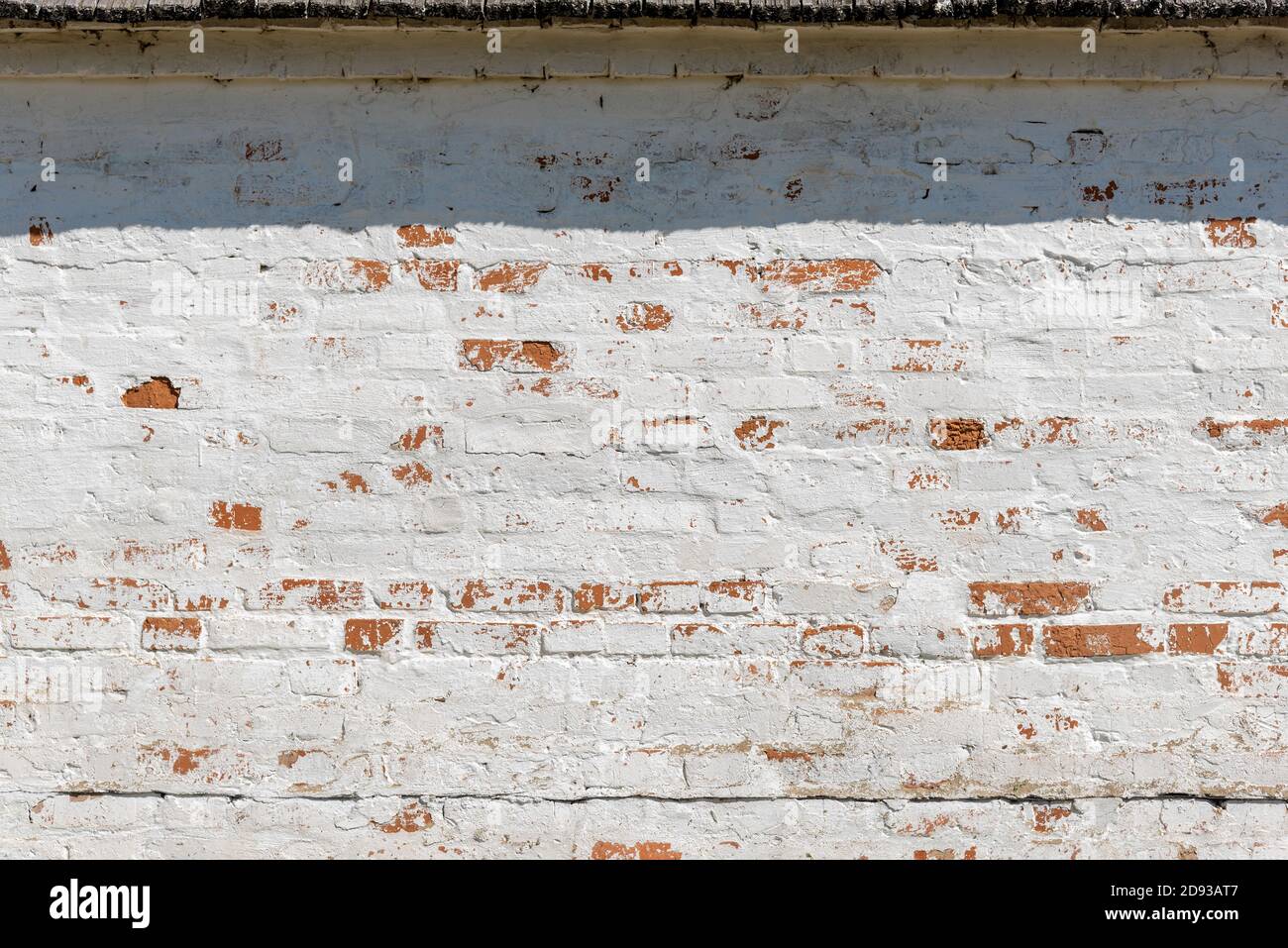 Old fashioned surface of wall with bricks and white stucco Stock Photo ...