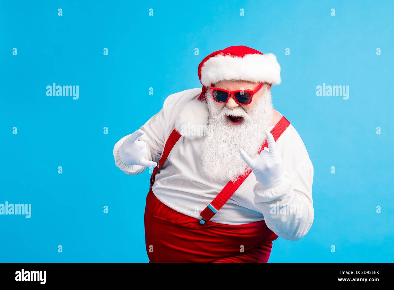 Crazy stylish santa claus with big stomach beard show horns symbol x ...