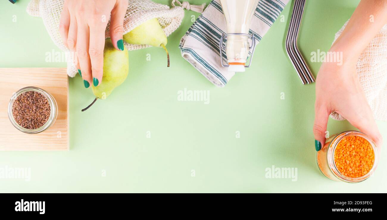Green zero waste background with accessories Stock Photo - Alamy