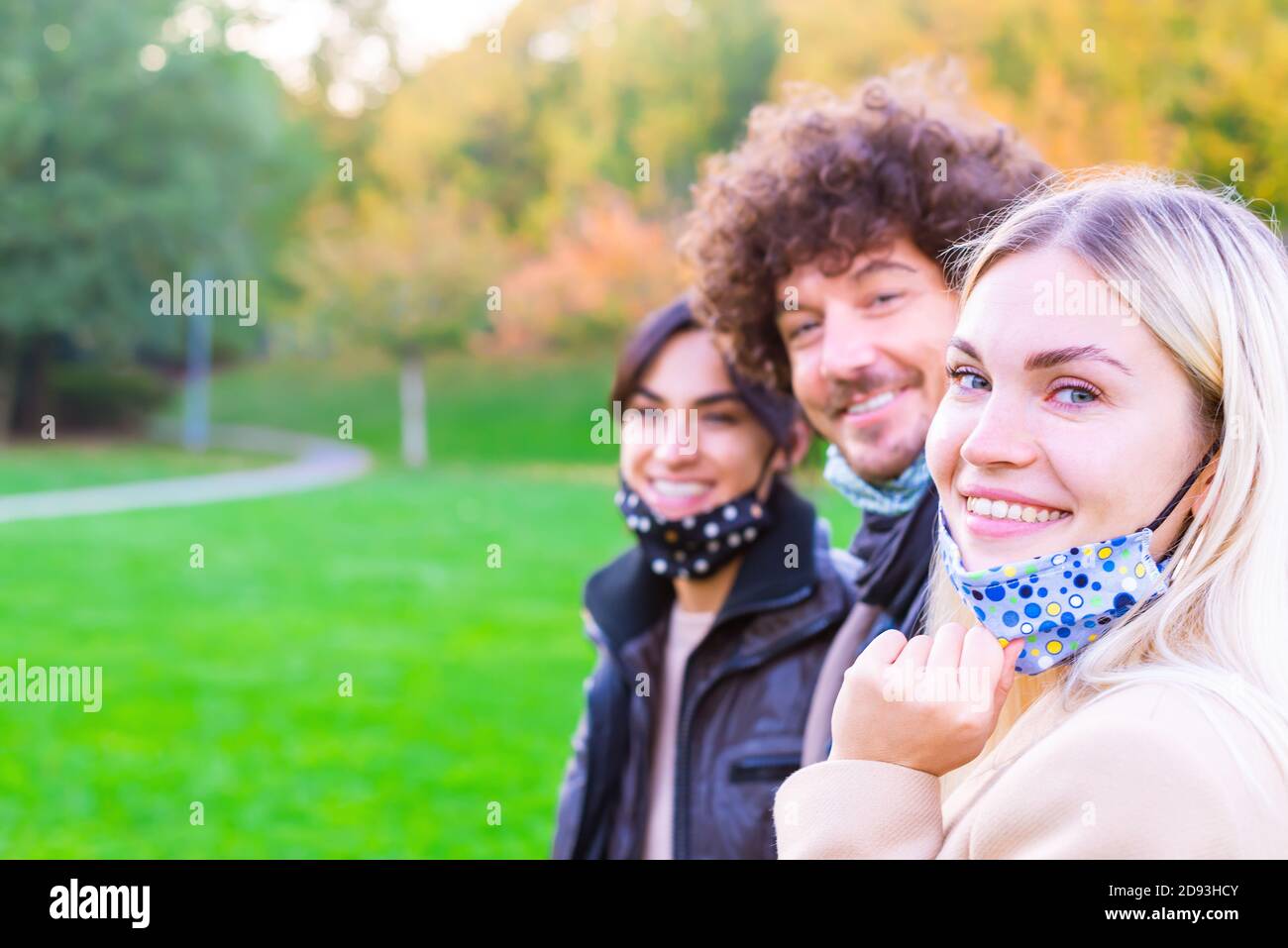 Young people having fun around city park during coronavirus outbreak ...