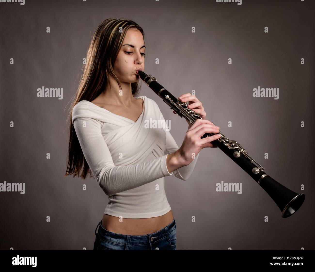 Young woman playing clarinet hi-res stock photography and images - Alamy