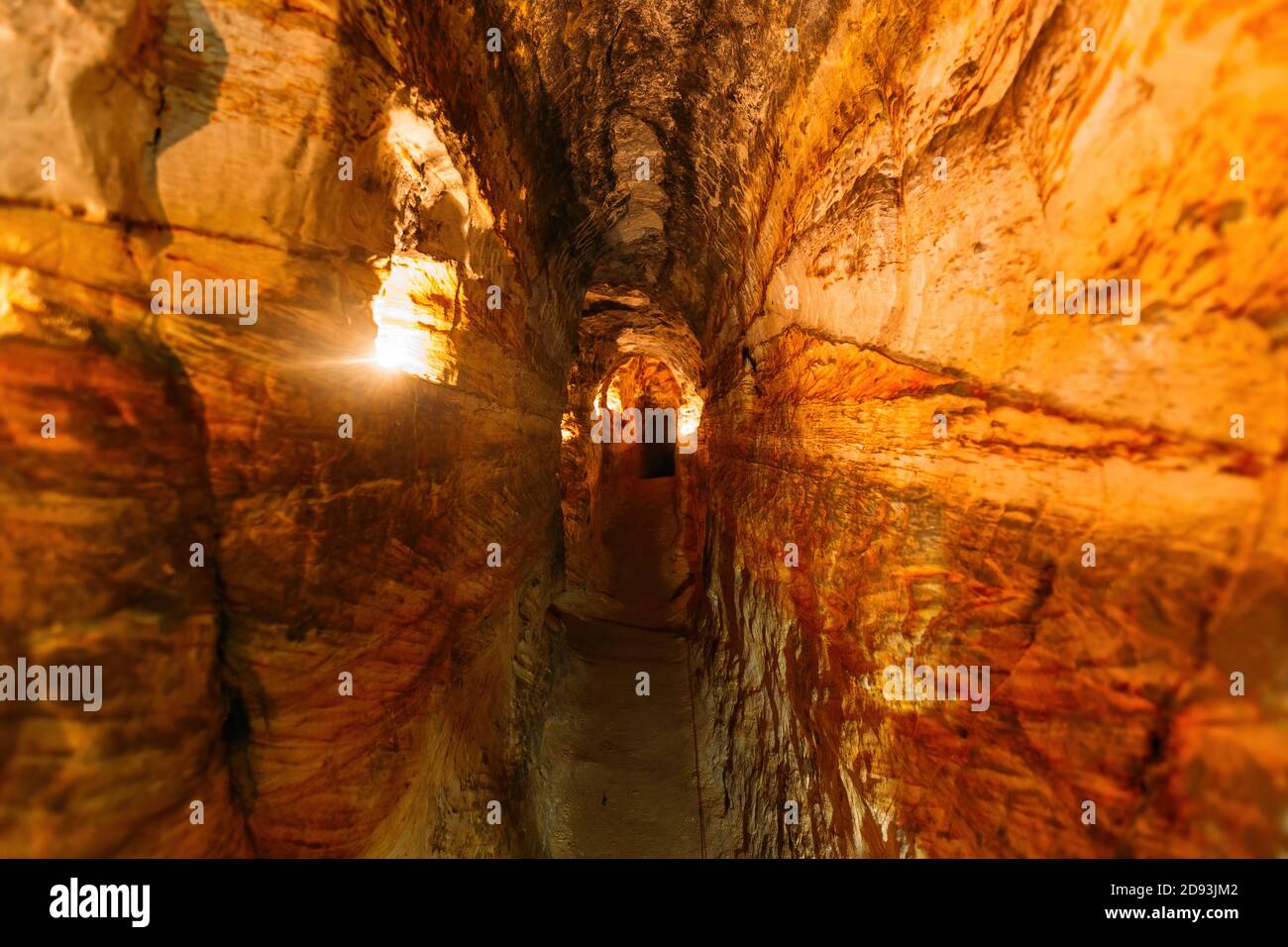 Ancient narrow underground passage in sandstone at old underground ...
