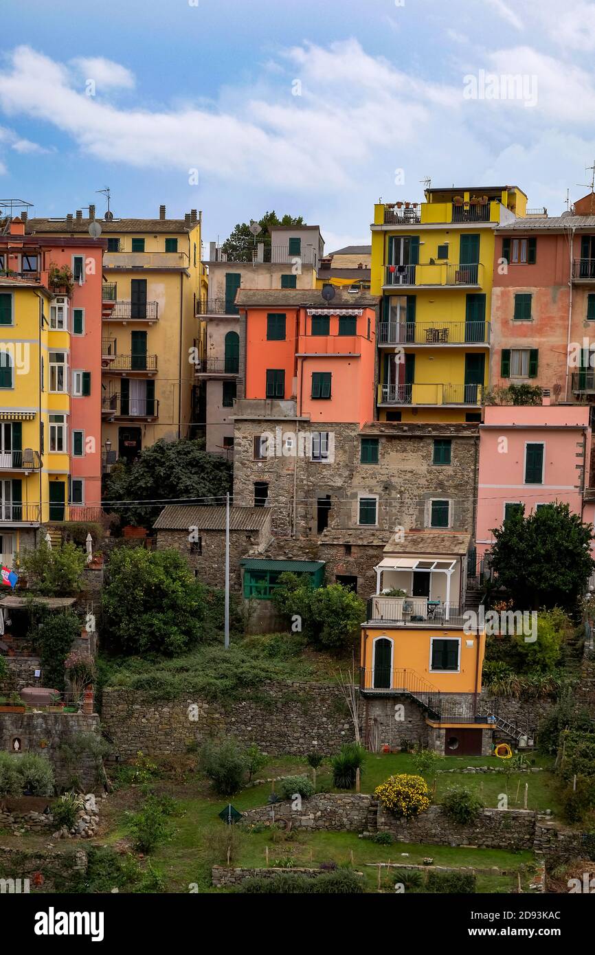 Colorful Houses Hanging in a Cliff with Terrace Green Fields ...