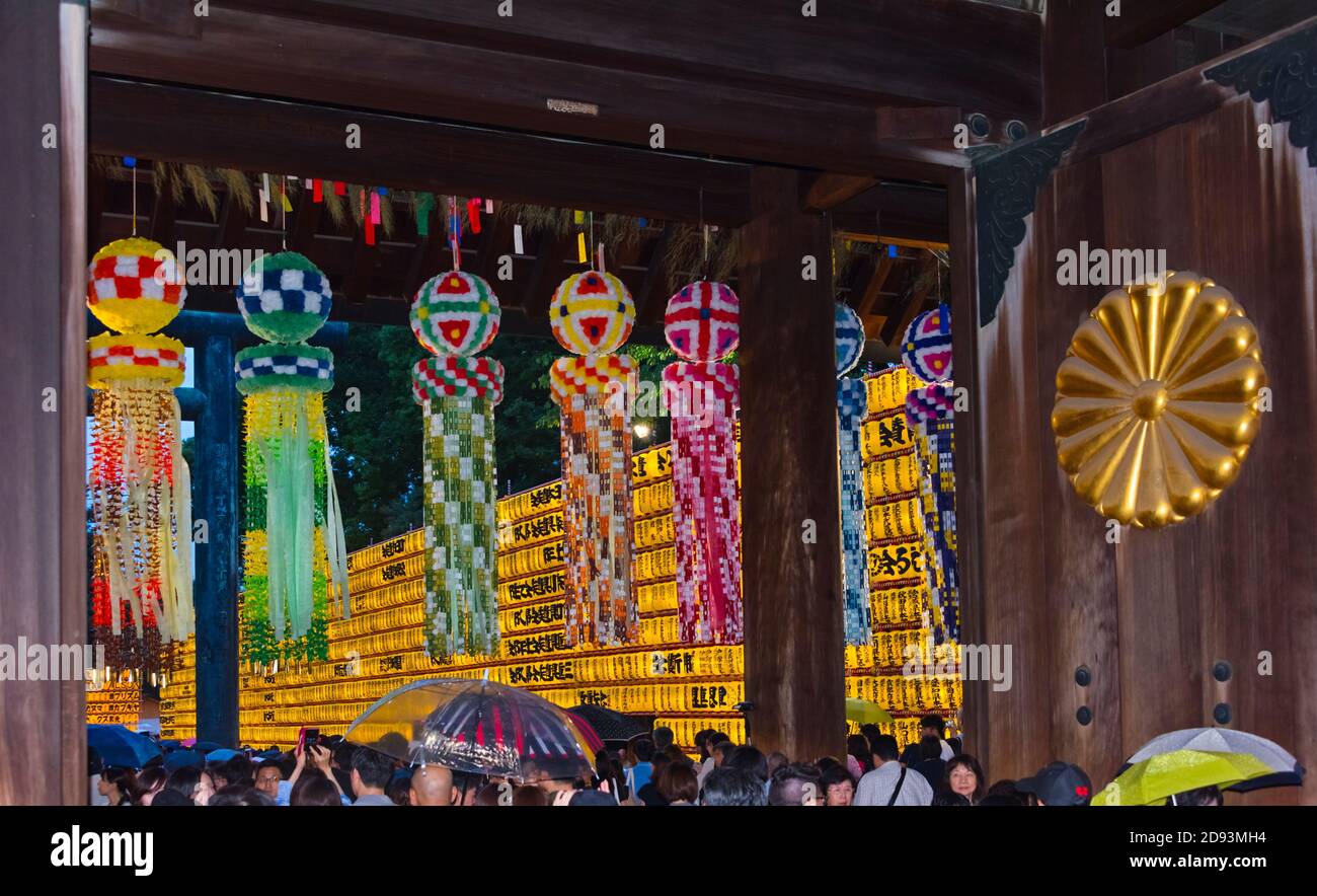 Crowd at the entrance of Yasukuni Shrine with colorful decoration ...