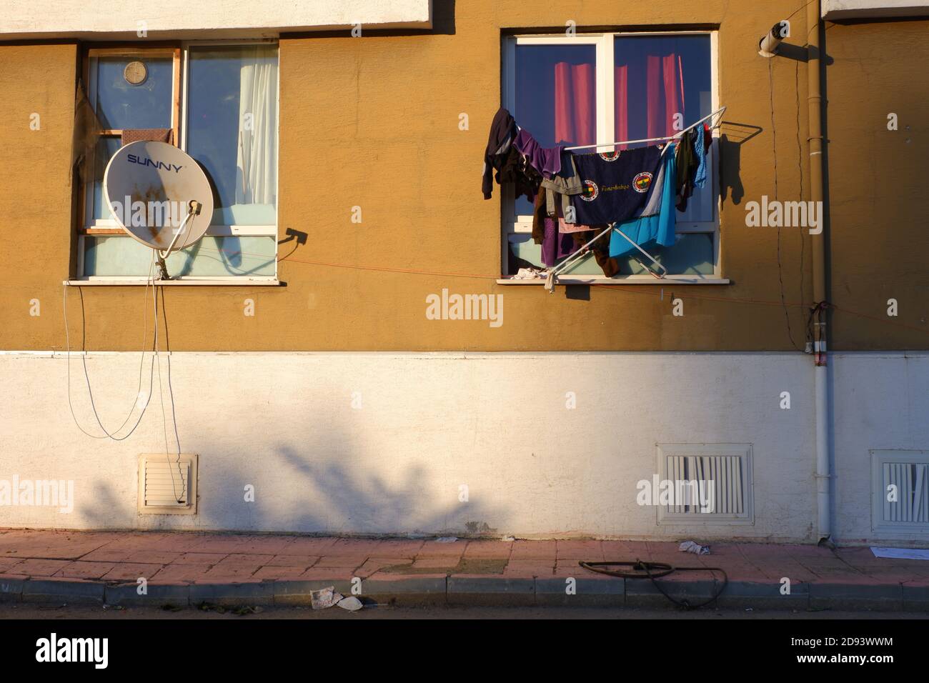 Clothes hanged out at window Stock Photo - Alamy