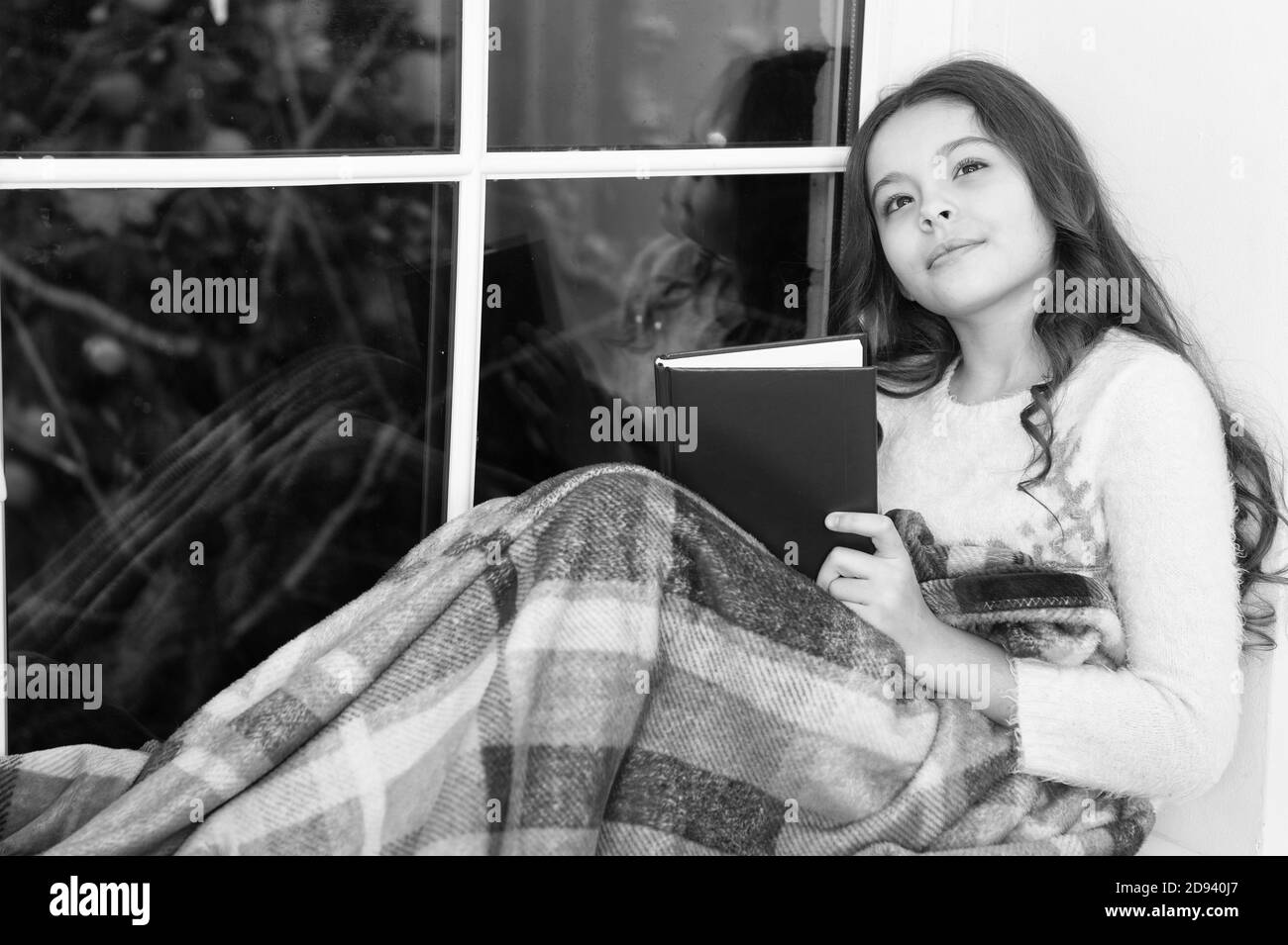 Christmas story that grabs imagination. Little girl read and imagine ...