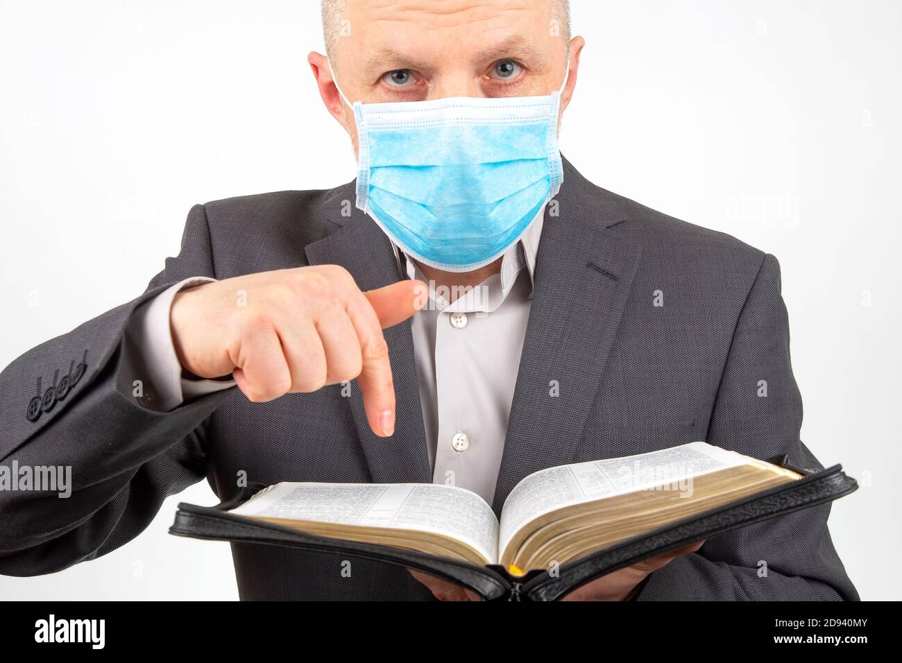 Man in suit holding bible hi-res stock photography and images - Alamy