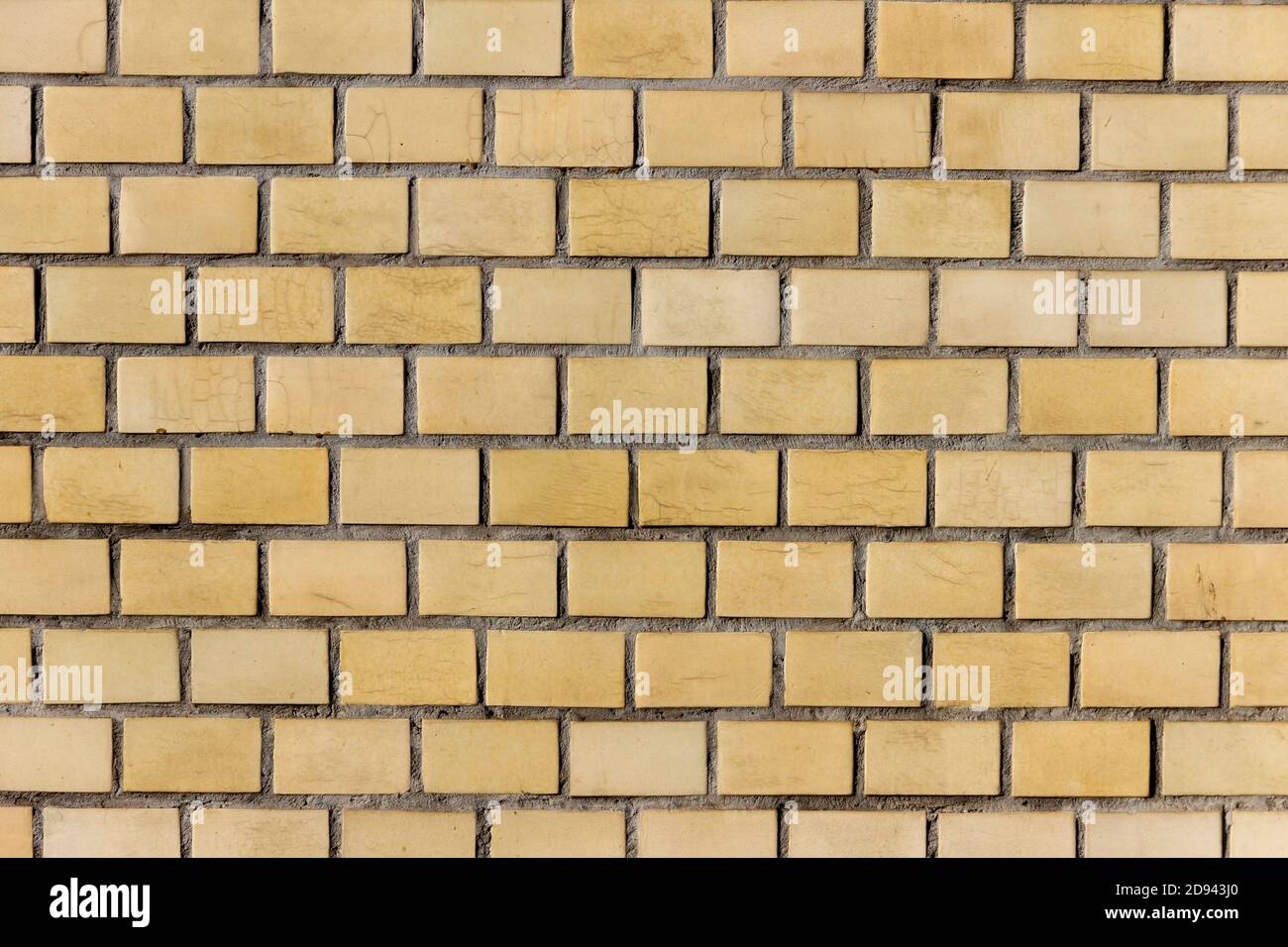 Surface of a yellow brick wall Stock Photo - Alamy