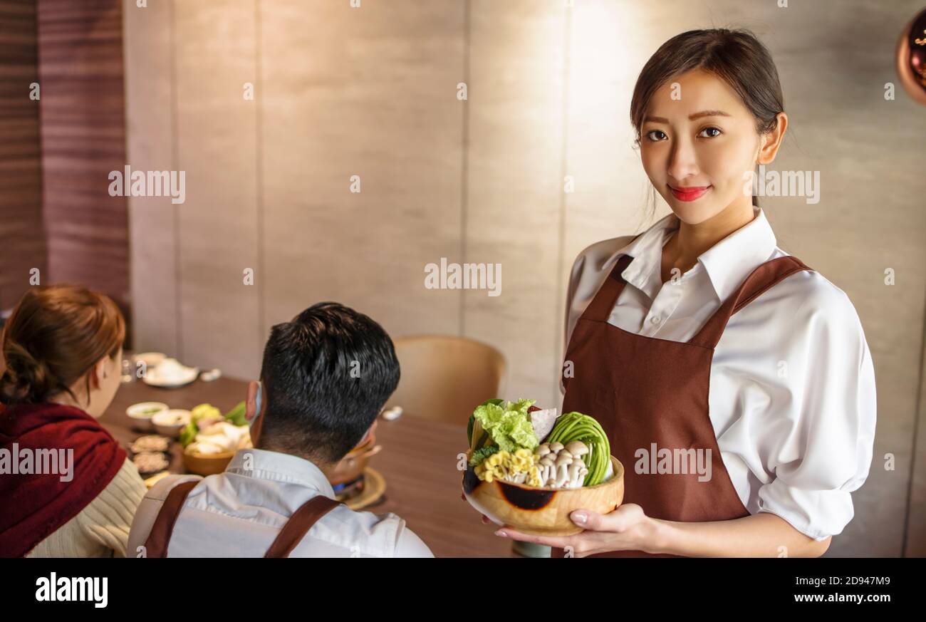 Waiter serving food restaurant hi-res stock photography and images - Alamy