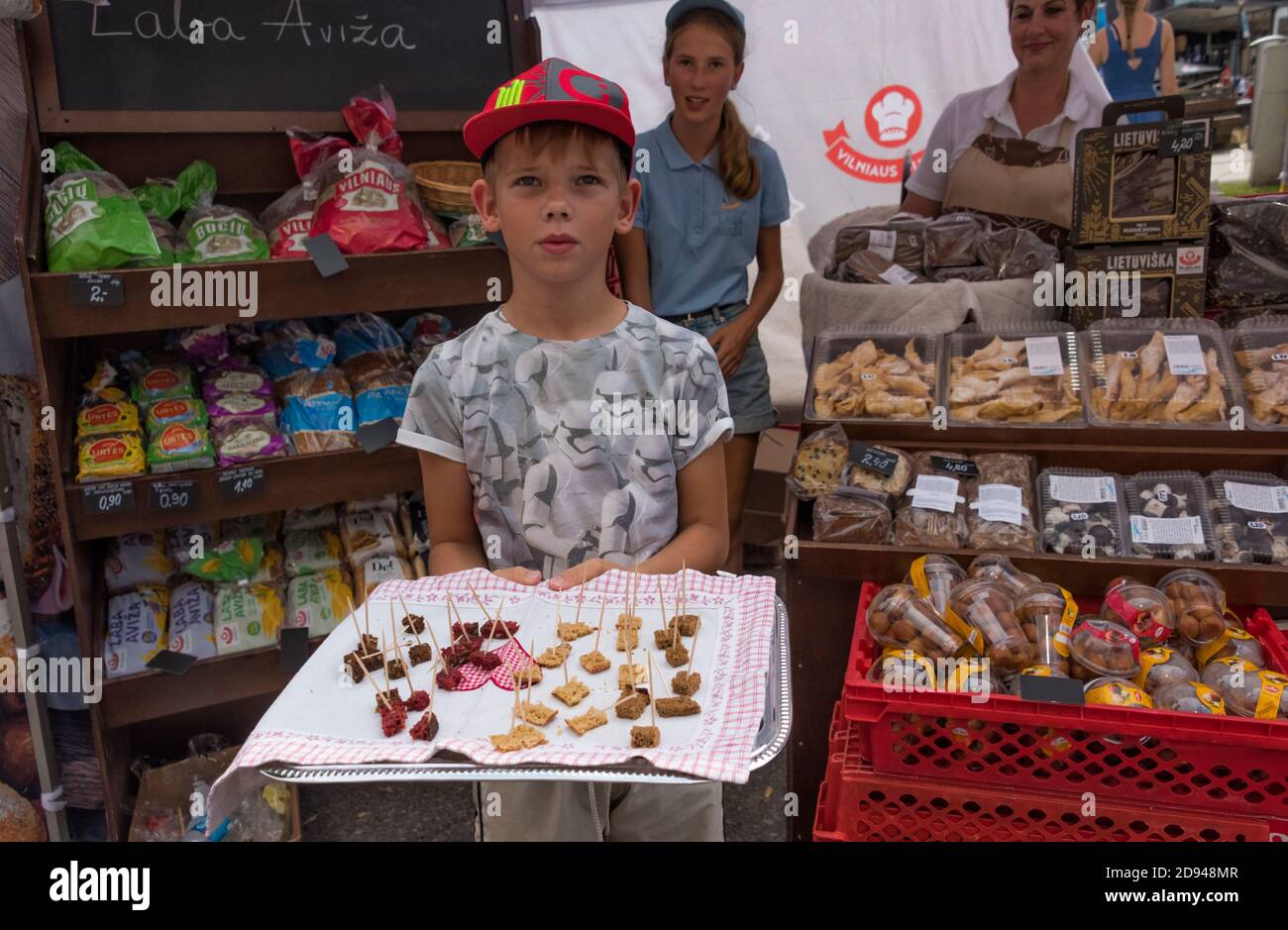 Boy selling cookies during Klaipeda Sea Festival, Klaipeda, Lithuania ...