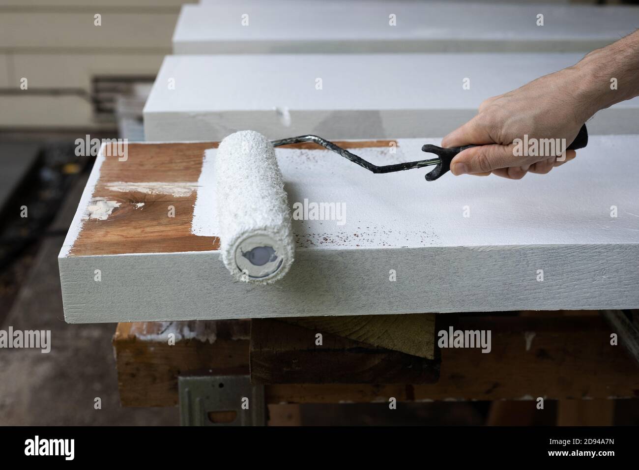 Male Hand Painting Wood Boards with White Paint and Paint Roller Stock ...