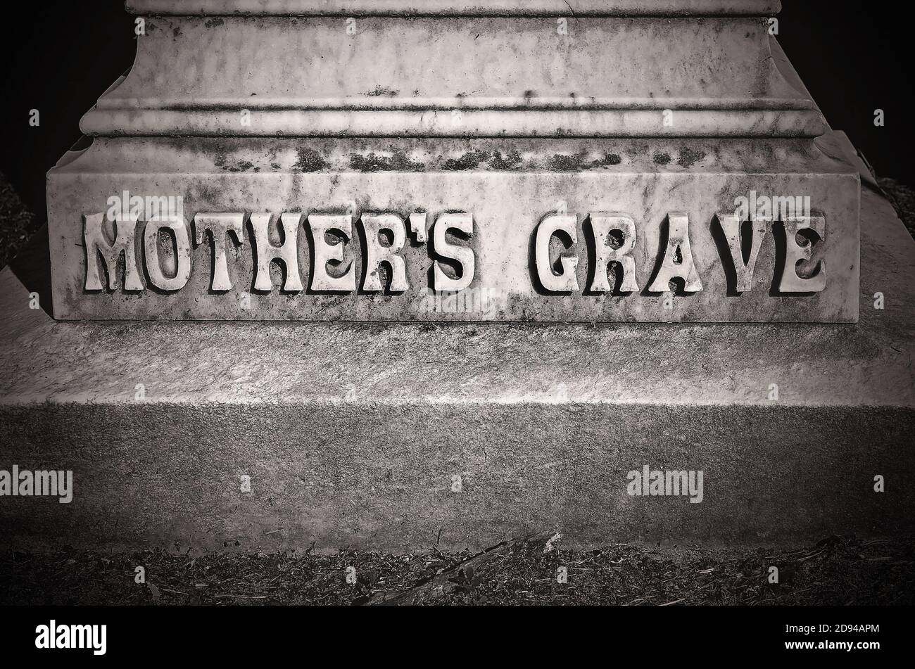 An ornate concrete headstone designates a mother’s grave in Church ...