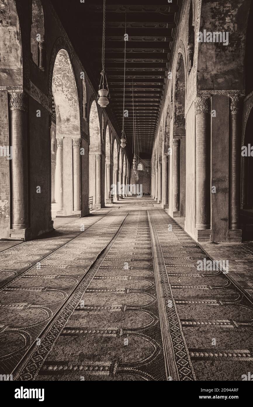 Sepia rendition of an Arcade of the Ibn Tulun Mosque showing the rows ...