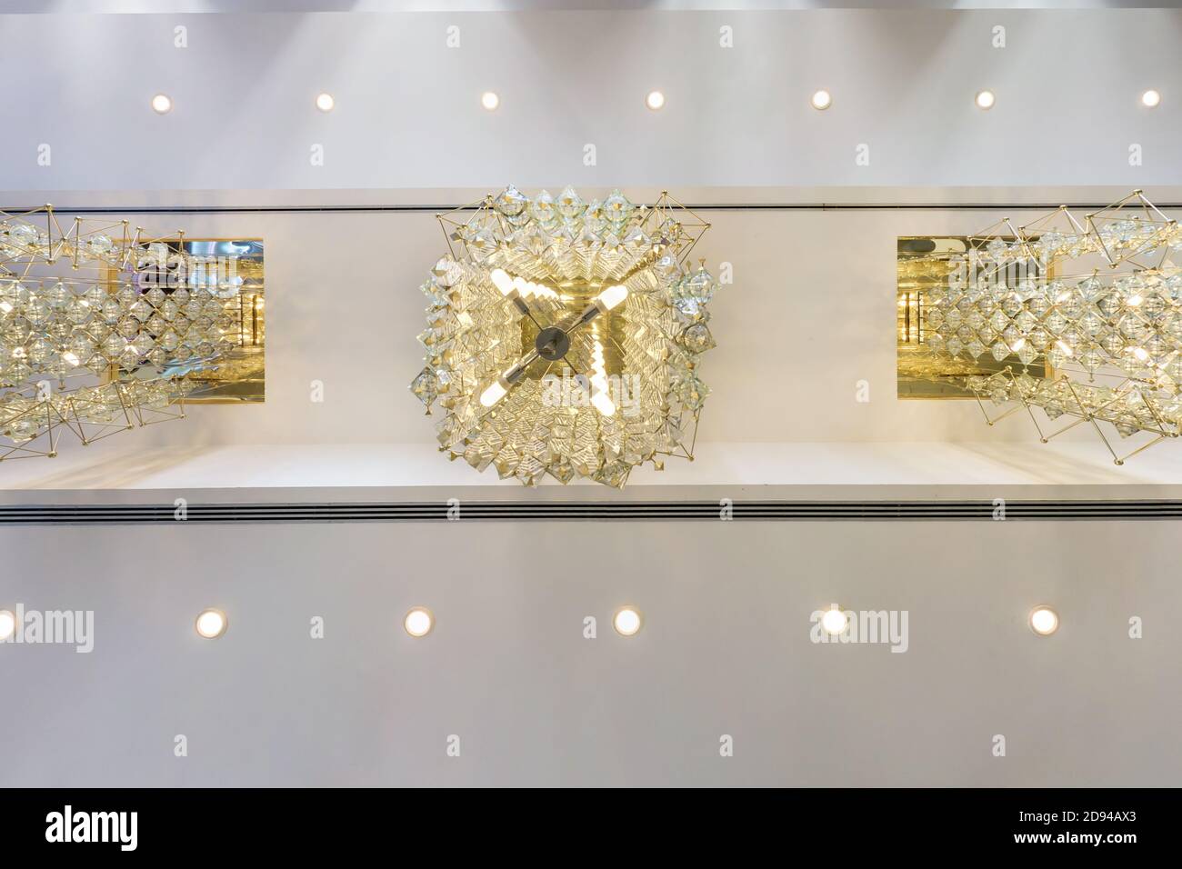 rhythmic texture on suspended ceiling with rows of halogen spots lamps ...