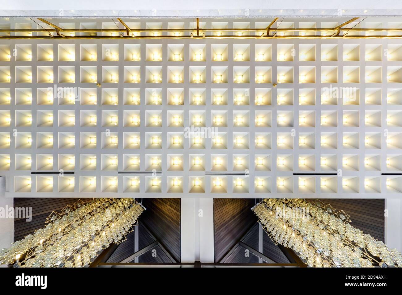 rhythmic texture on suspended ceiling with rows of halogen spots lamps ...