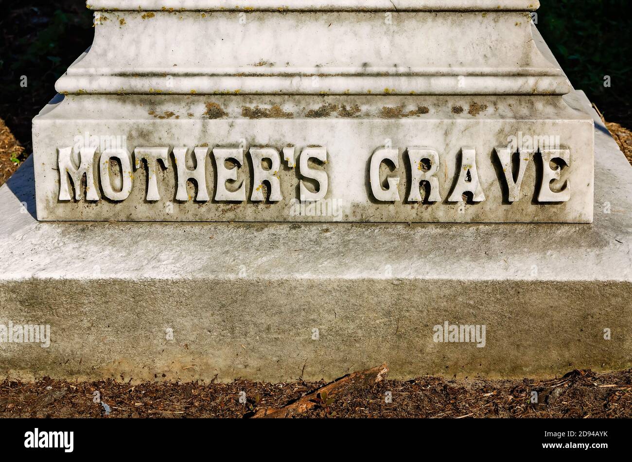 An ornate concrete headstone designates a mother’s grave in Church ...
