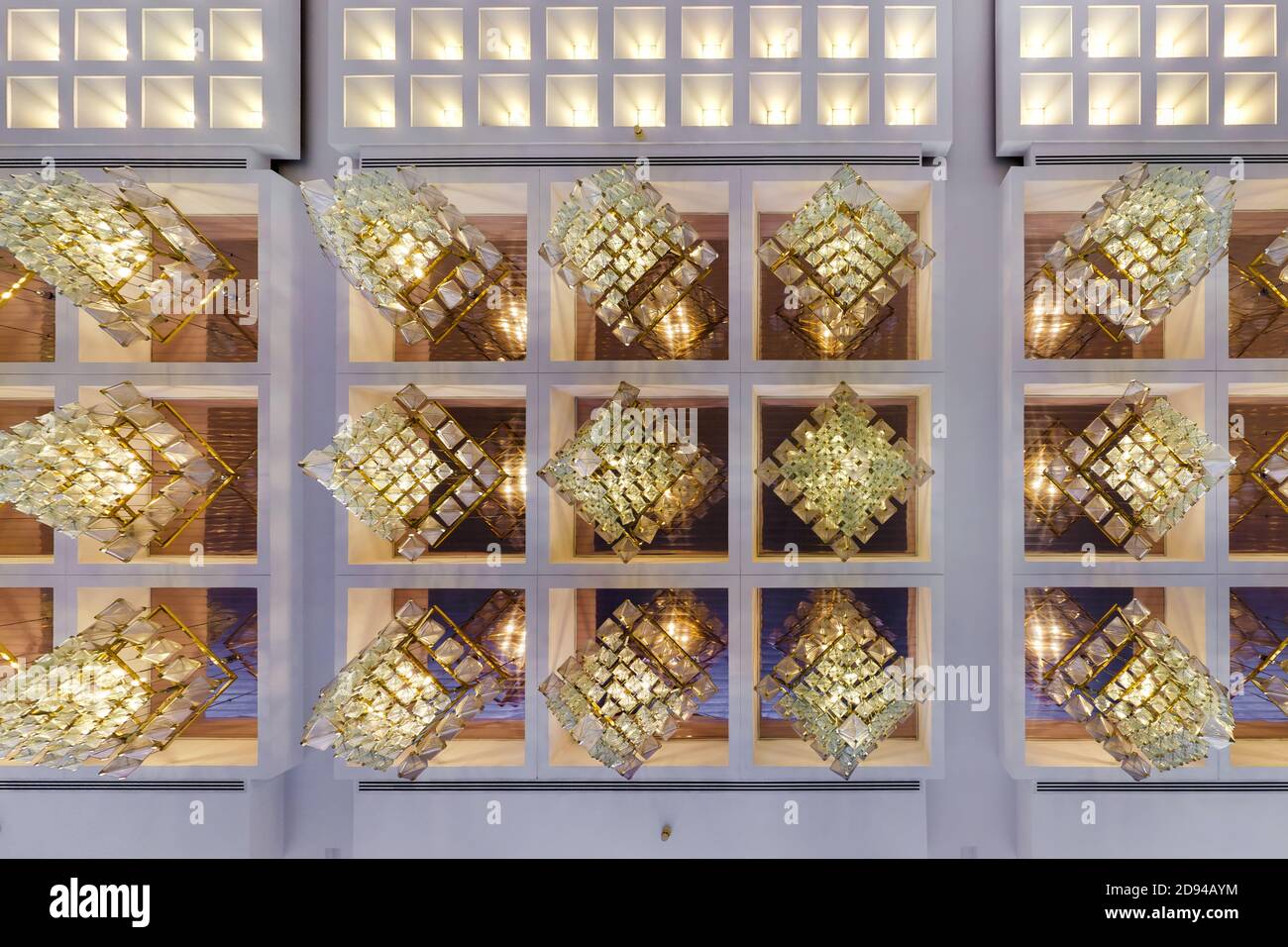 rhythmic texture on suspended ceiling with rows of halogen spots lamps ...