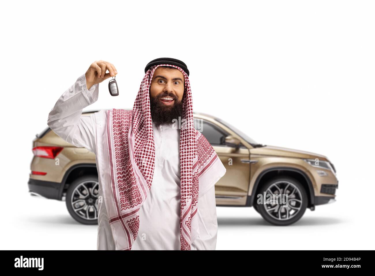 Arab man with a new suv smiling and holfing keys isolated on white ...