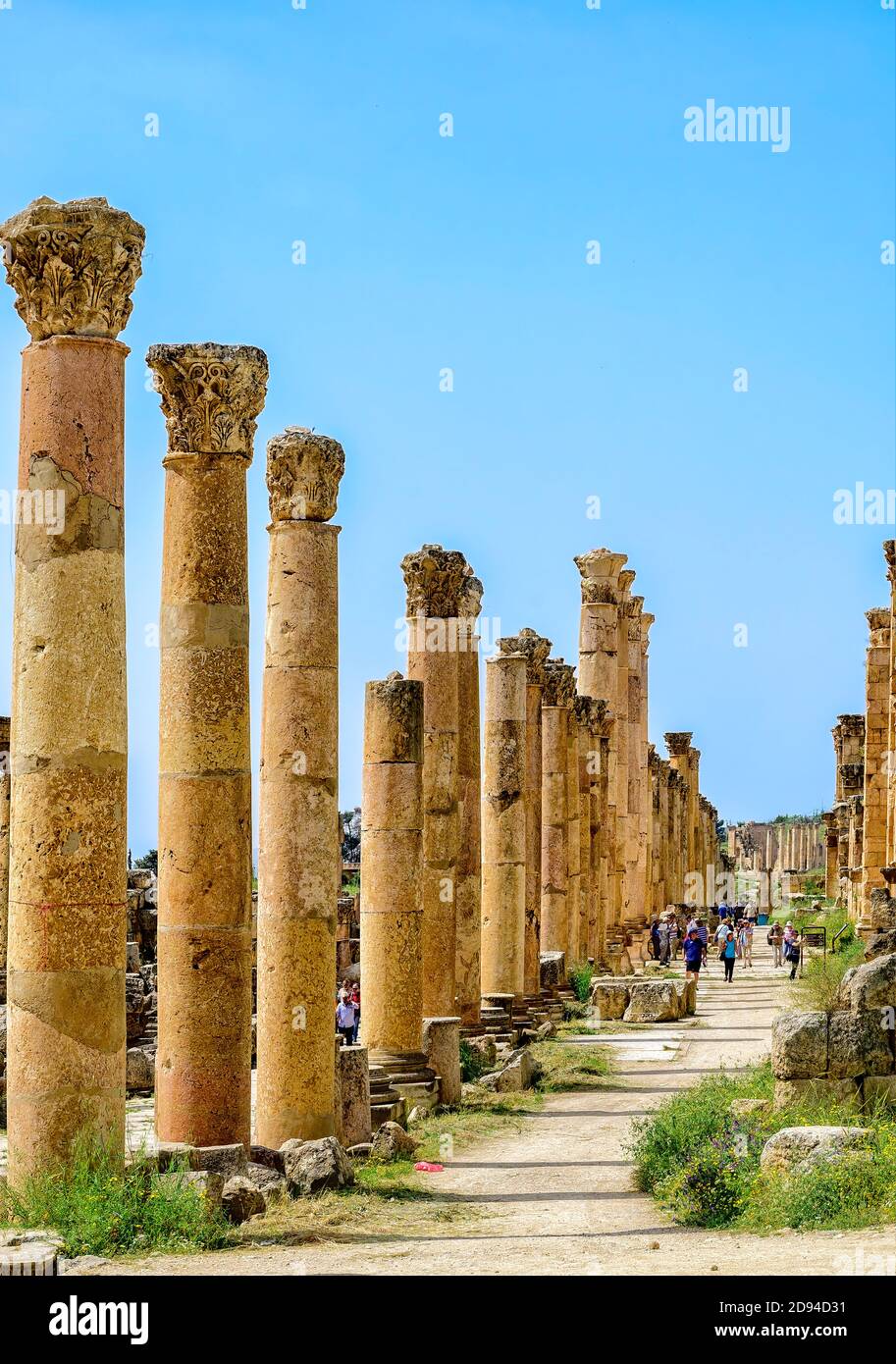 Tourists stroll along the ancient colonnaded Cardo Maximus street of ...