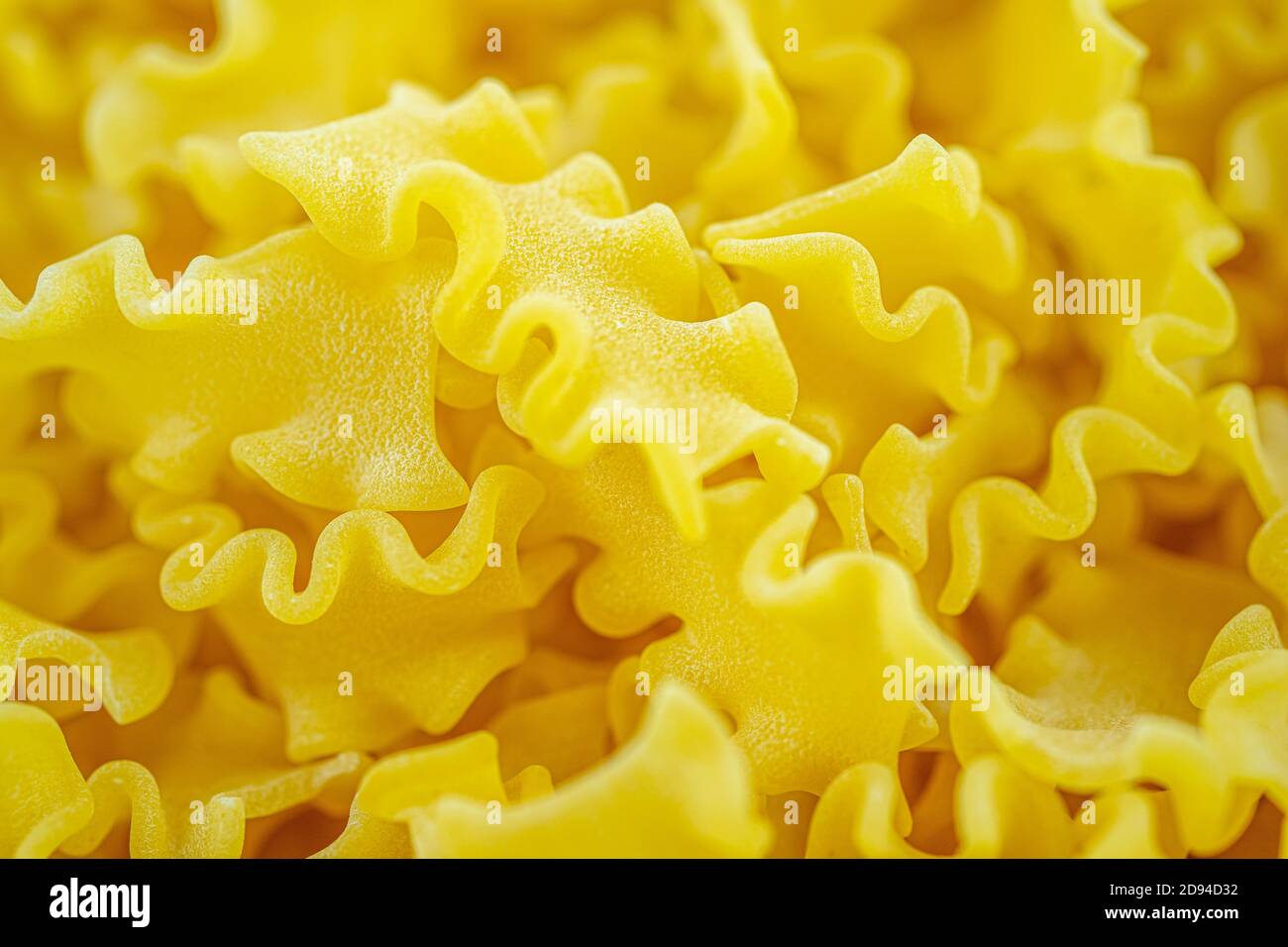 Italian dry wavy pasta background. Healthy traditional food. Top view ...