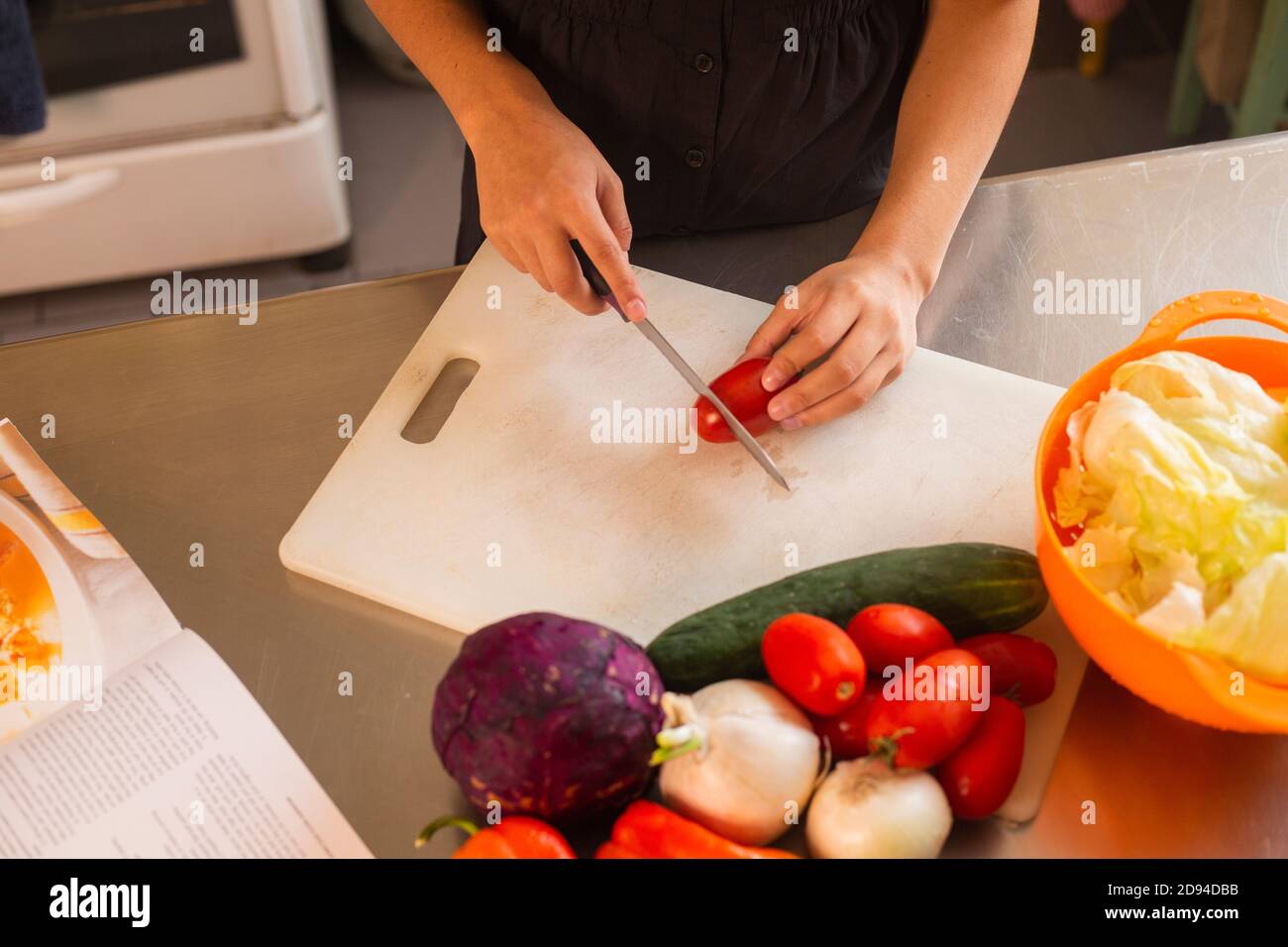 detail of woman hands cutting vegetables in her kitchen Stock Photo - Alamy