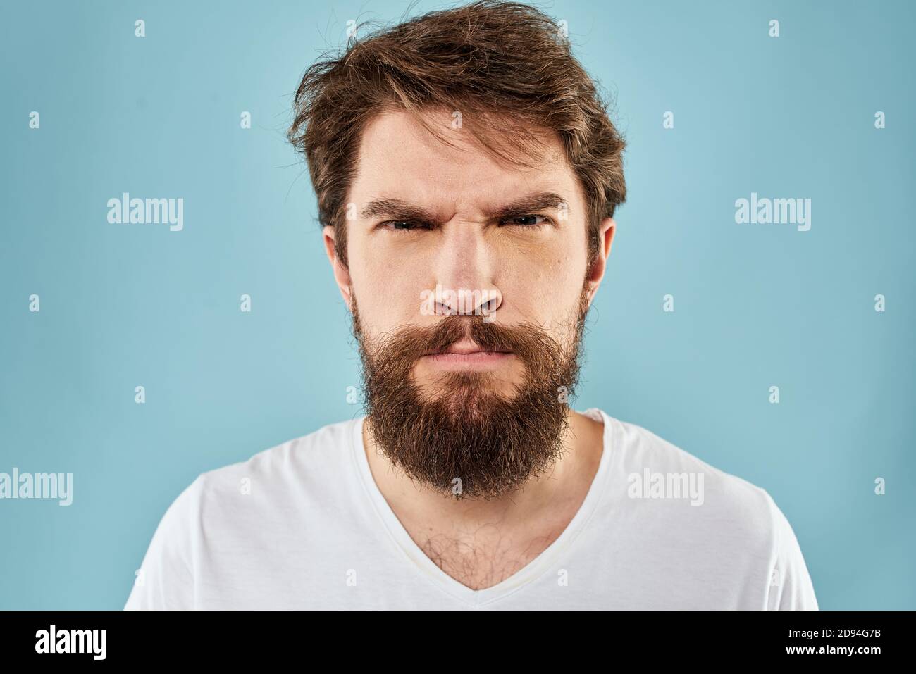 Bearded man emotions facial expression gestures hands close-up blue ...