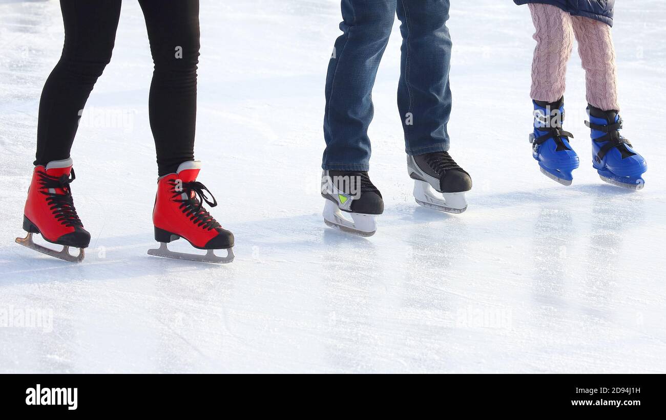 Feet of people skating on a street ice rink Stock Photo - Alamy